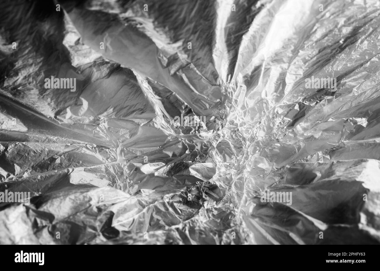 Unusual black and white pattern of crumpled and melted polyethylene ...