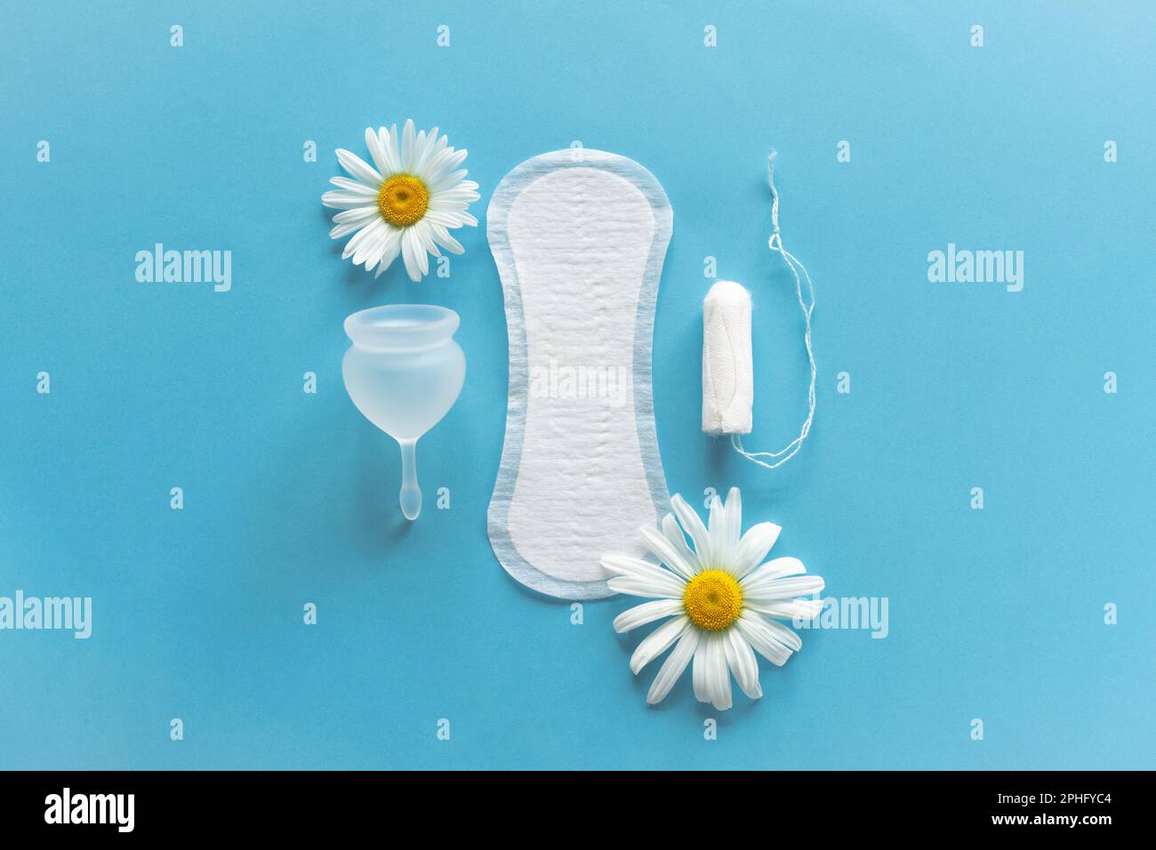 Hygienic white female pad, Menstrual cup and tampon with chamomile ...