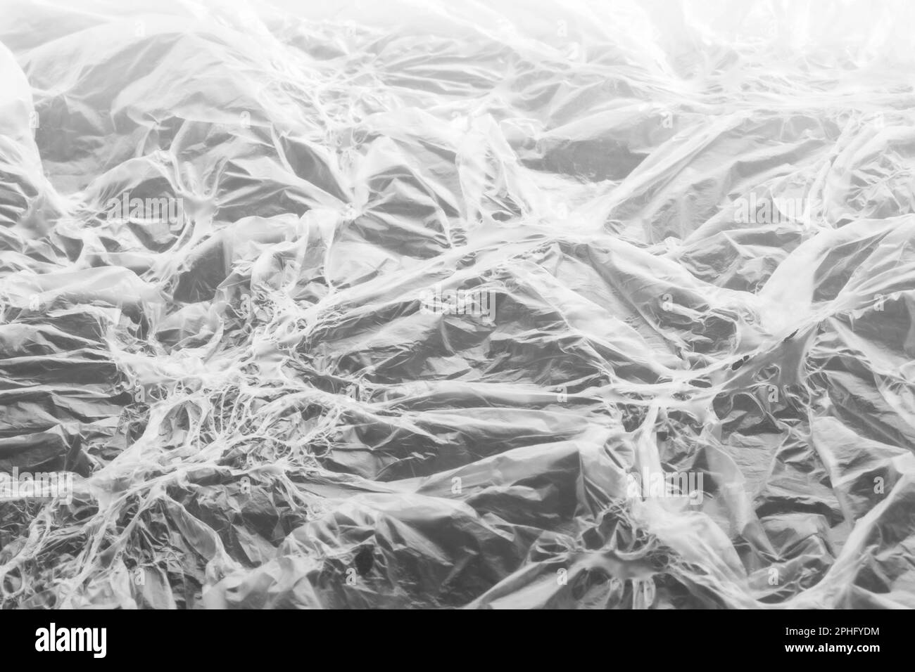 Interesting texture of white melted polyethylene on gray background ...