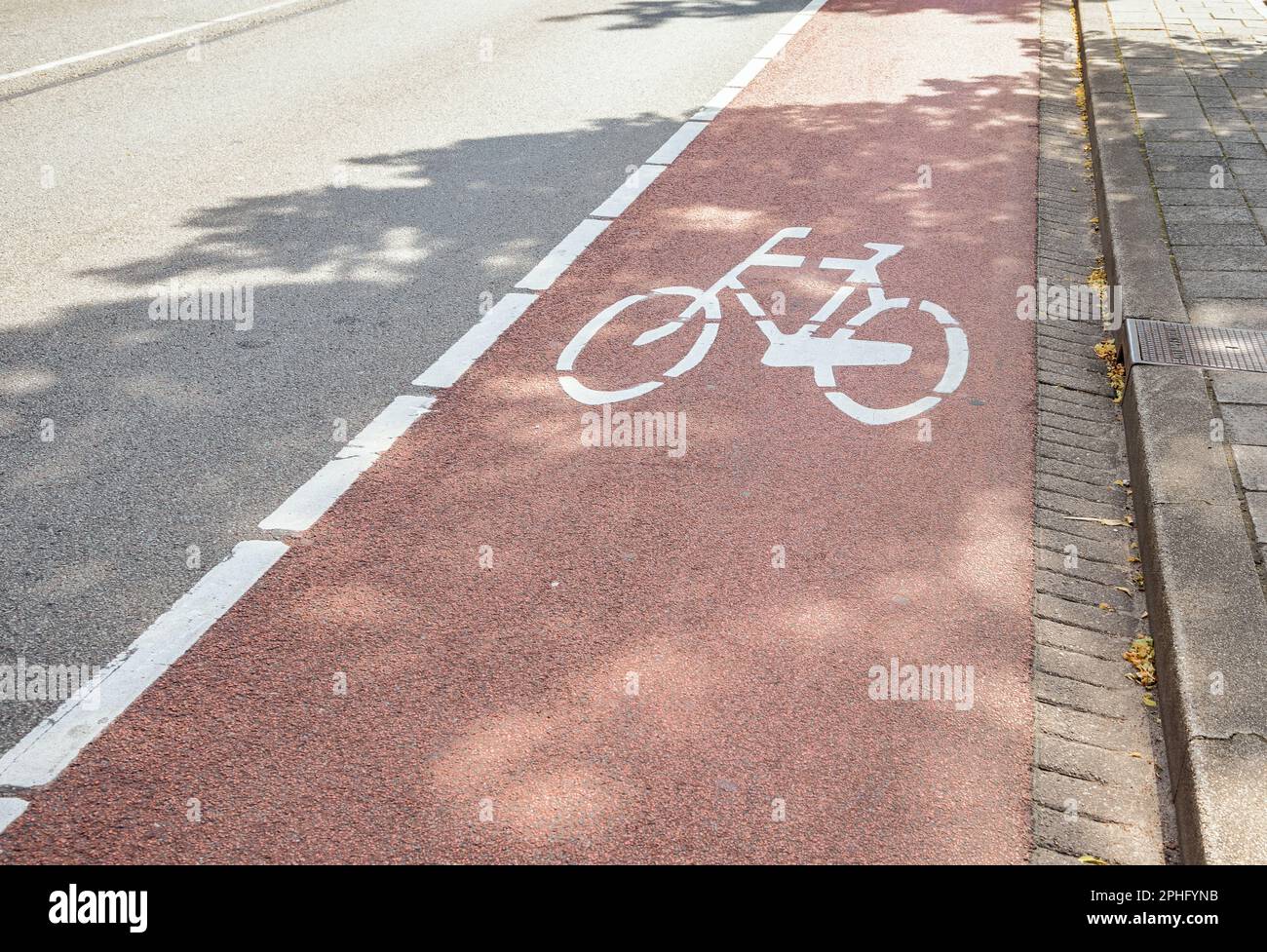 Bicycle lane along a street in a city centre Stock Photo - Alamy