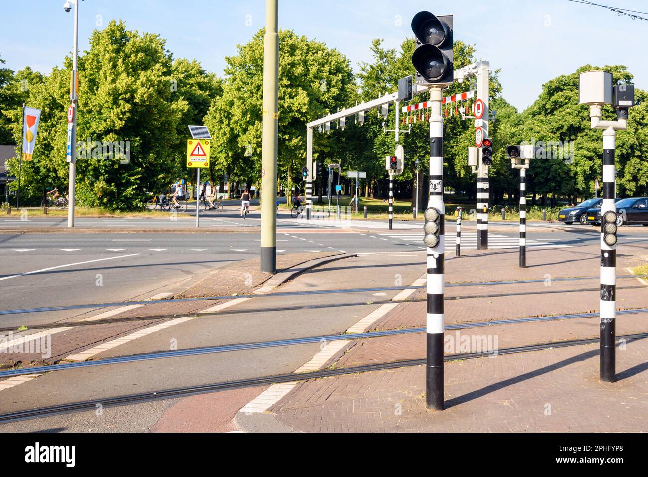Traffic lights at an intersection in a city centre on a sunny summer ...