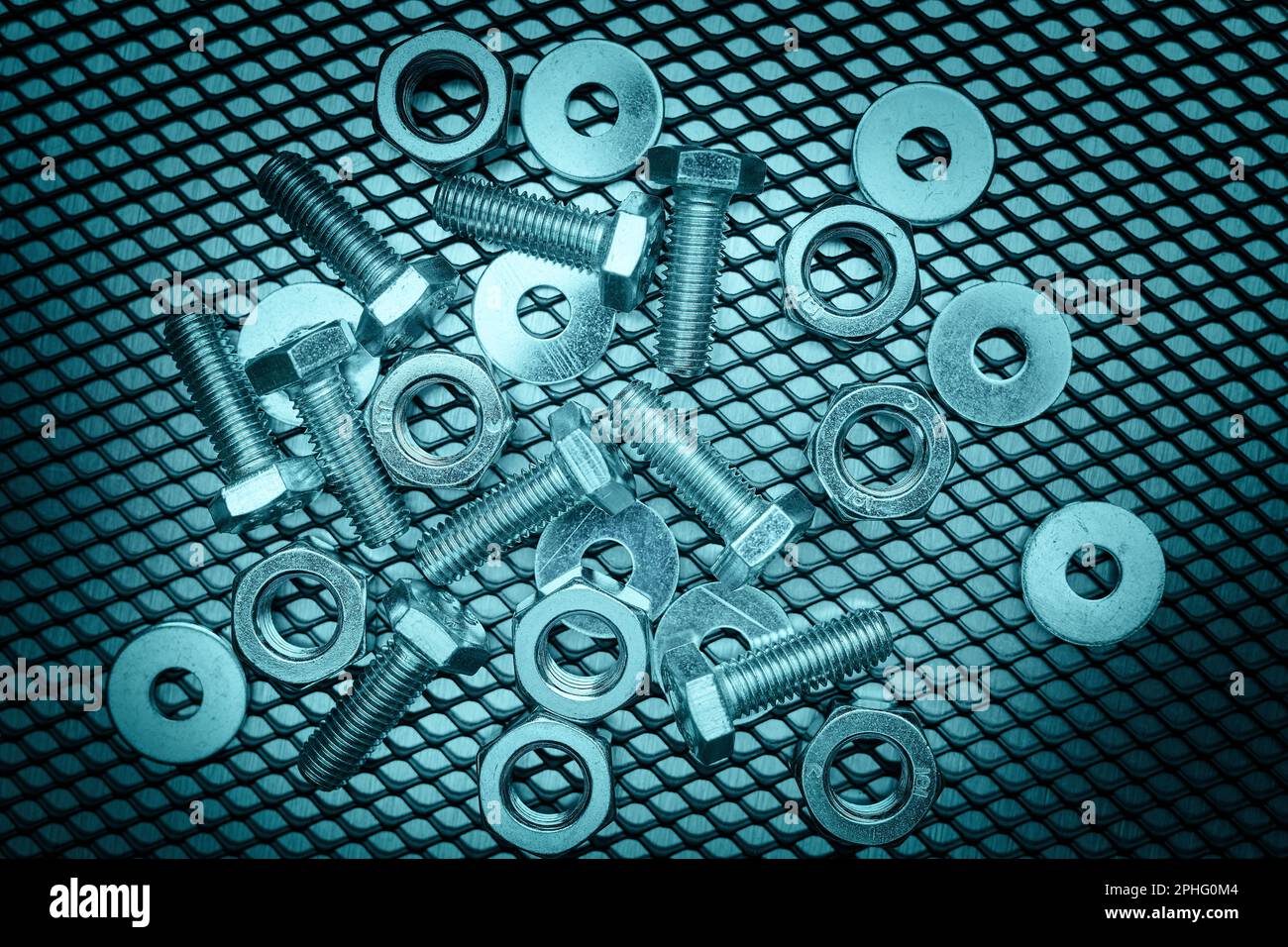 Bolts and nuts on steel surface. Mechanic items for maintenance ...