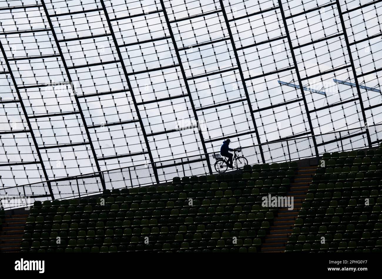 Munich, Germany. 28th Mar, 2023. An employee of the Olympic Stadium ...