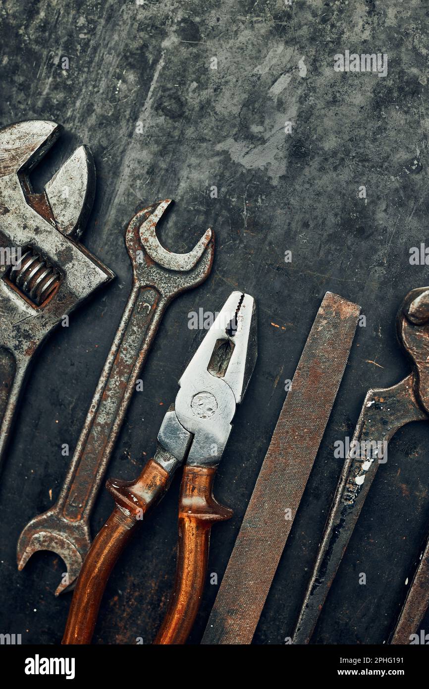 Old hardware tools. Wrench, screwdriver, measure, hammer, pliers on ...
