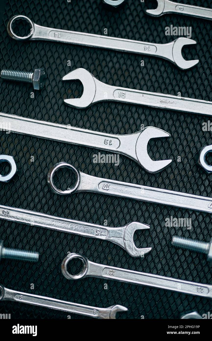 Set of chrome wrenches on steel surface. Mechanic tools for maintenance ...