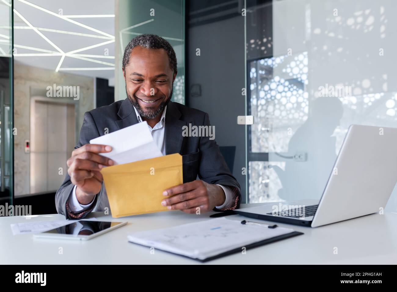 African american businessman reading good news, man inside office ...