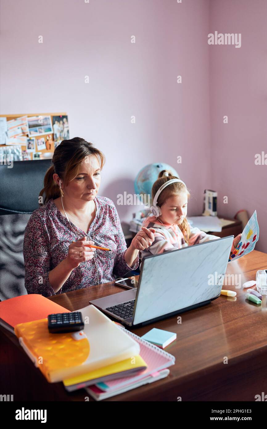 Woman mother working doing her job remotely during video chat call ...