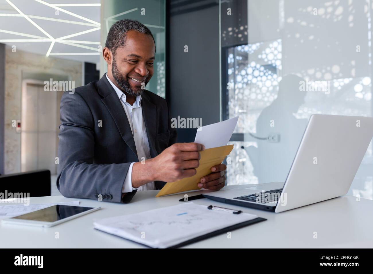 African american businessman reading good news, man inside office ...