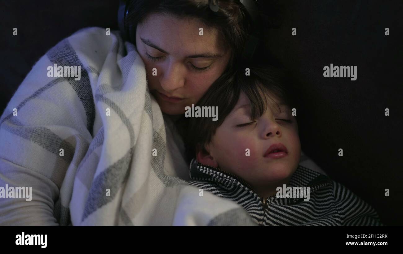 Mother and child asleep together on couch. Lifestyle family moment of ...