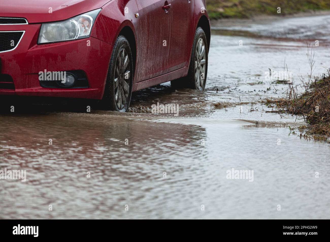 Car stuck in the mud, car wheel in dirty puddle, rough terrain Stock ...