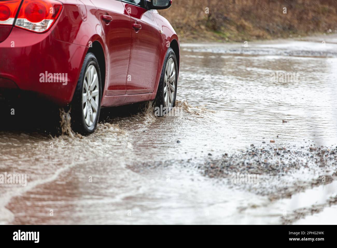 Car stuck in the mud, car wheel in dirty puddle, rough terrain Stock ...