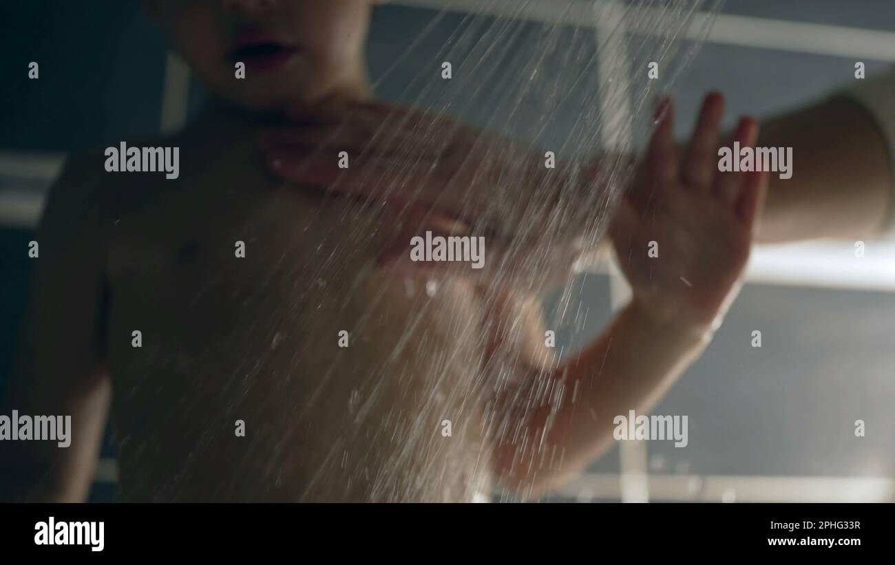 Showering child during domestic lifestyle routine. Bathing little boy ...