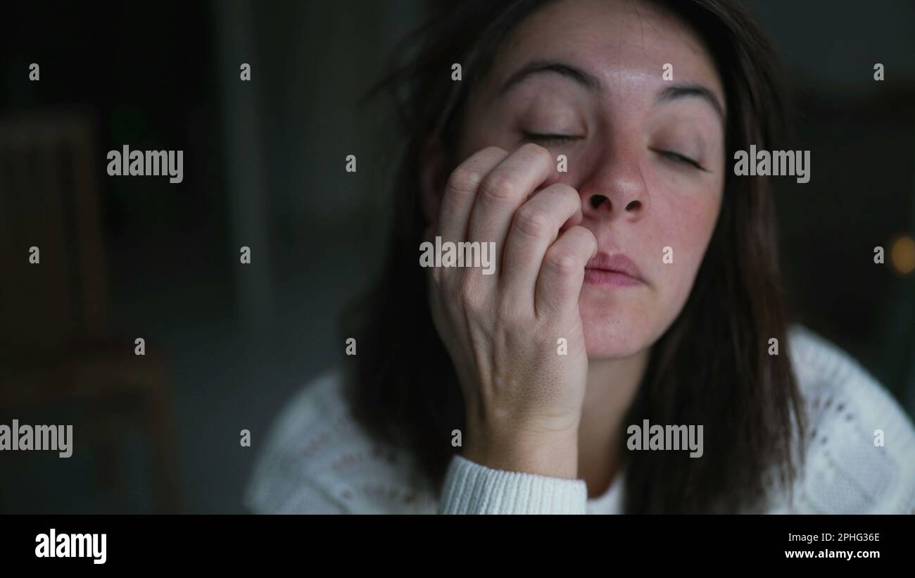 One pensive woman scratching face at home while thinking about life ...