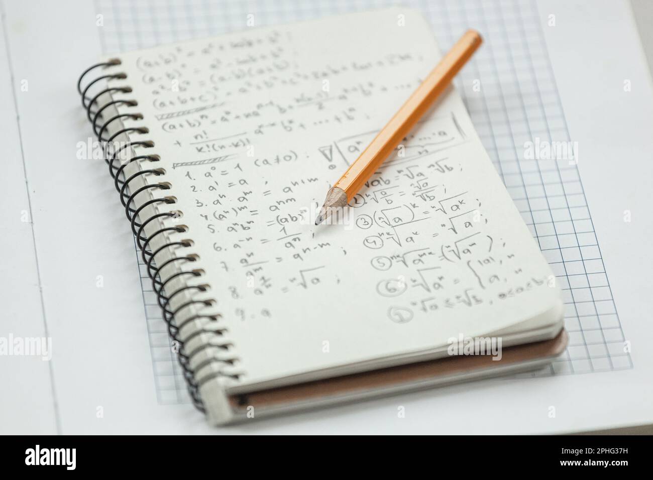 Math formulas are written in pencil on a piece of paper, math pr Stock ...