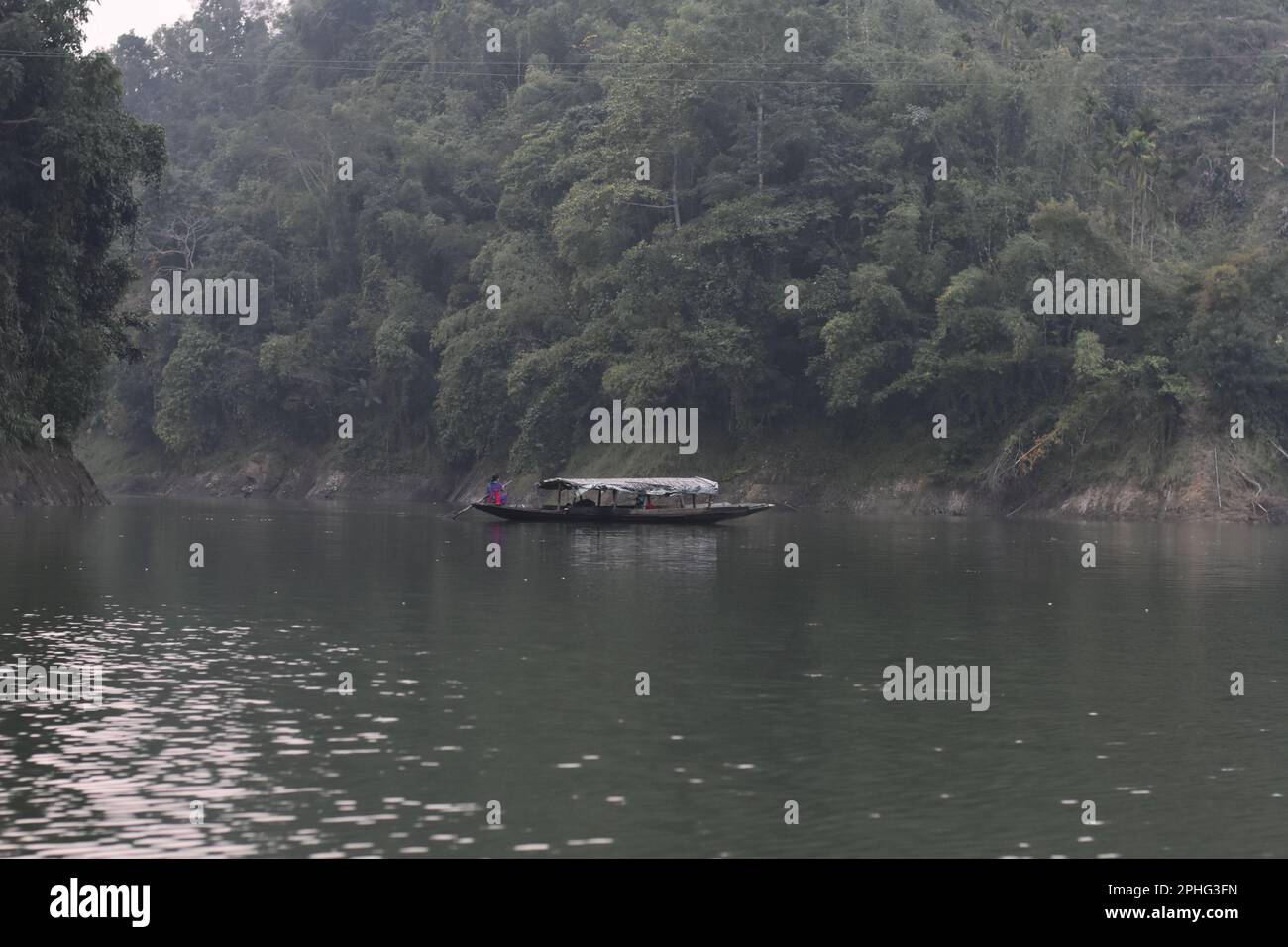 A boat in Dumboor lake of Tripura , India . With clear water Stock ...