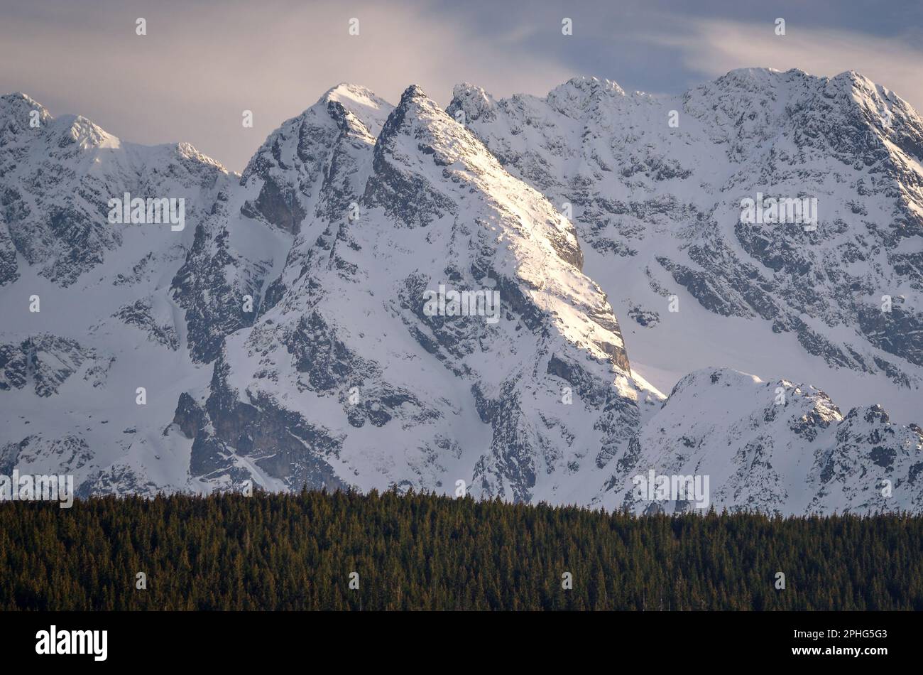Beautiful evening view of the snow-capped mountains. View of the ...