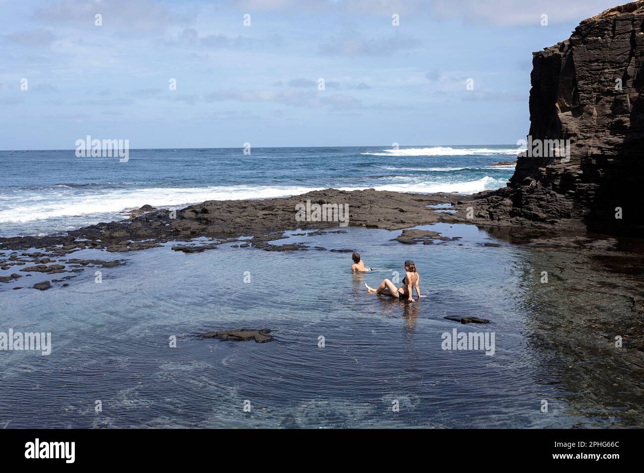 Mother and son, tourists relaxing in a natural pools of the atlantic ...