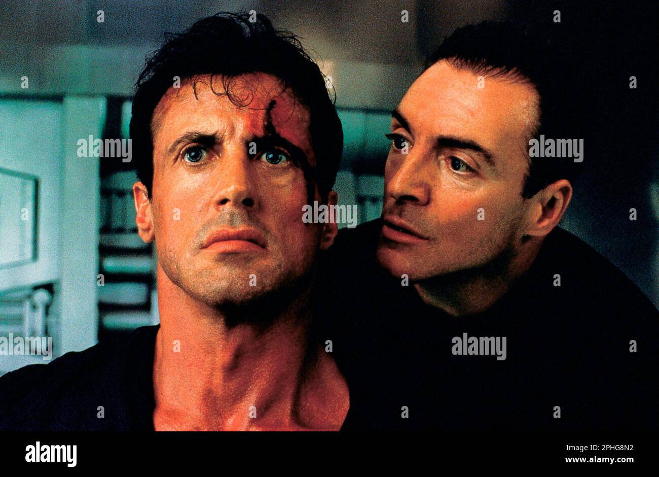 ARMAND ASSANTE and SYLVESTER STALLONE in JUDGE DREDD (1995), directed ...