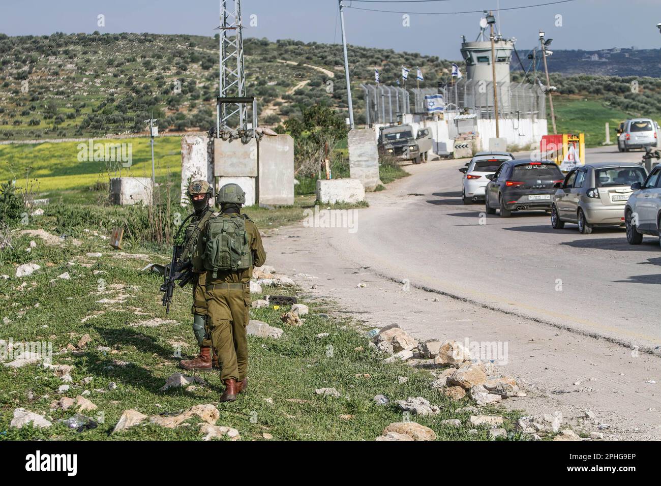Northern West Bank, Palestine. 27th Mar, 2023. Israeli soldiers guard ...