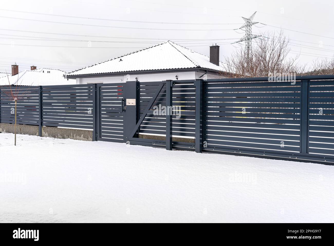 Modern panel fence in anthracite color, visible sliding gate and wicket ...