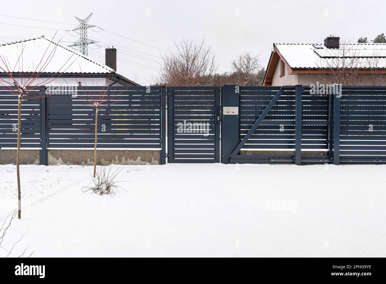 Modern panel fence in anthracite color, visible sliding gate and wicket ...
