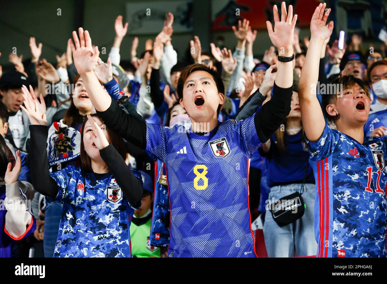 Osaka, Japan. 28th Mar, 2023. Soccer fans chanting songs in support of ...