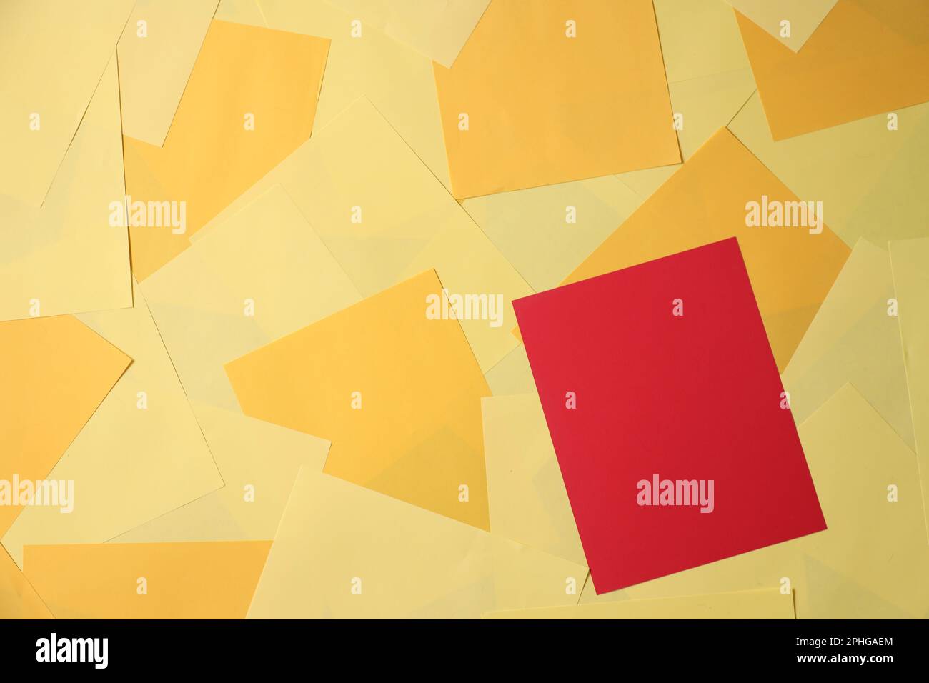 A red sticky note is placed on a vibrant yellow background, composed of ...