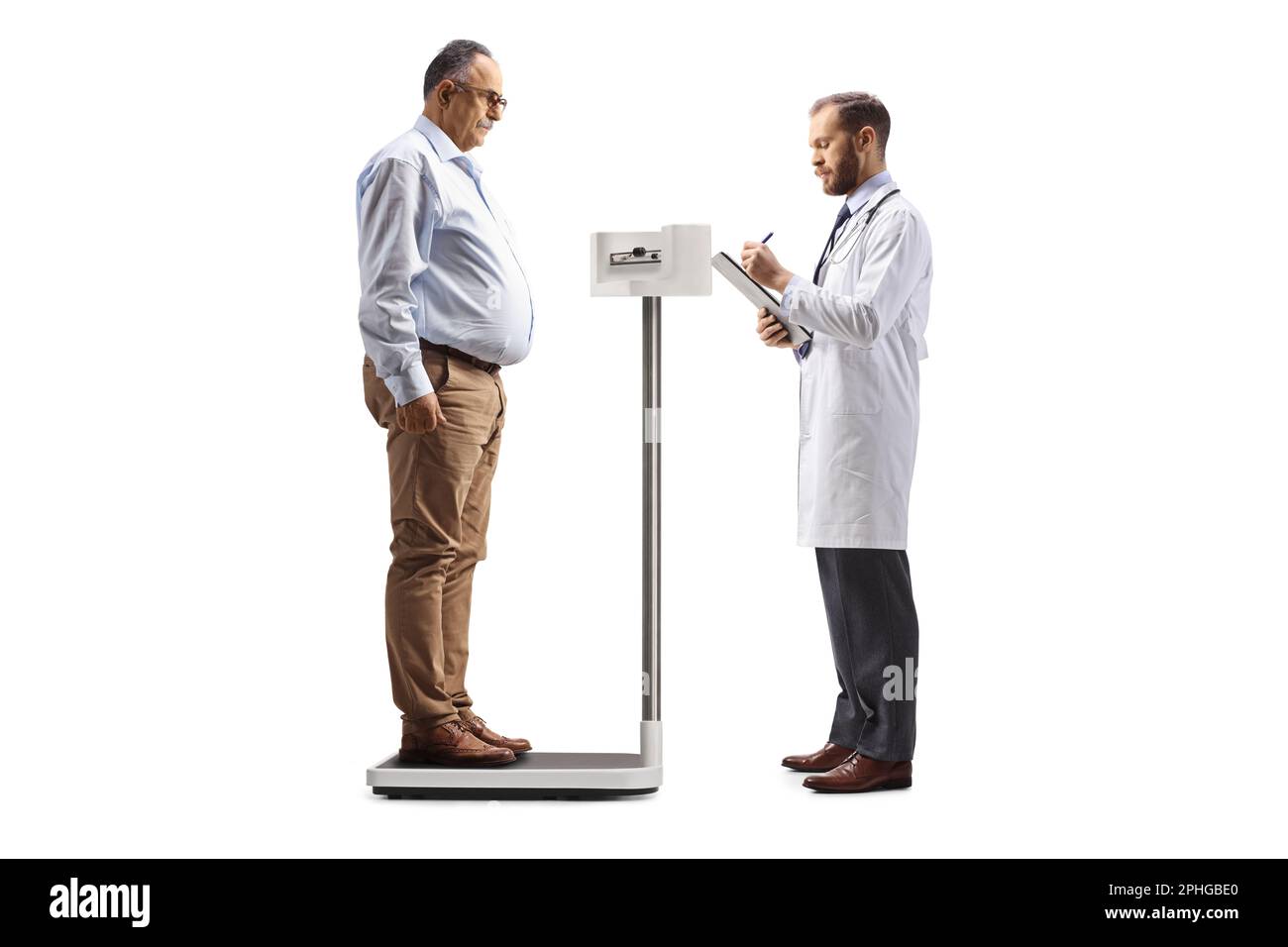 Mature man weighing on a professional scale and doctor writing a ...