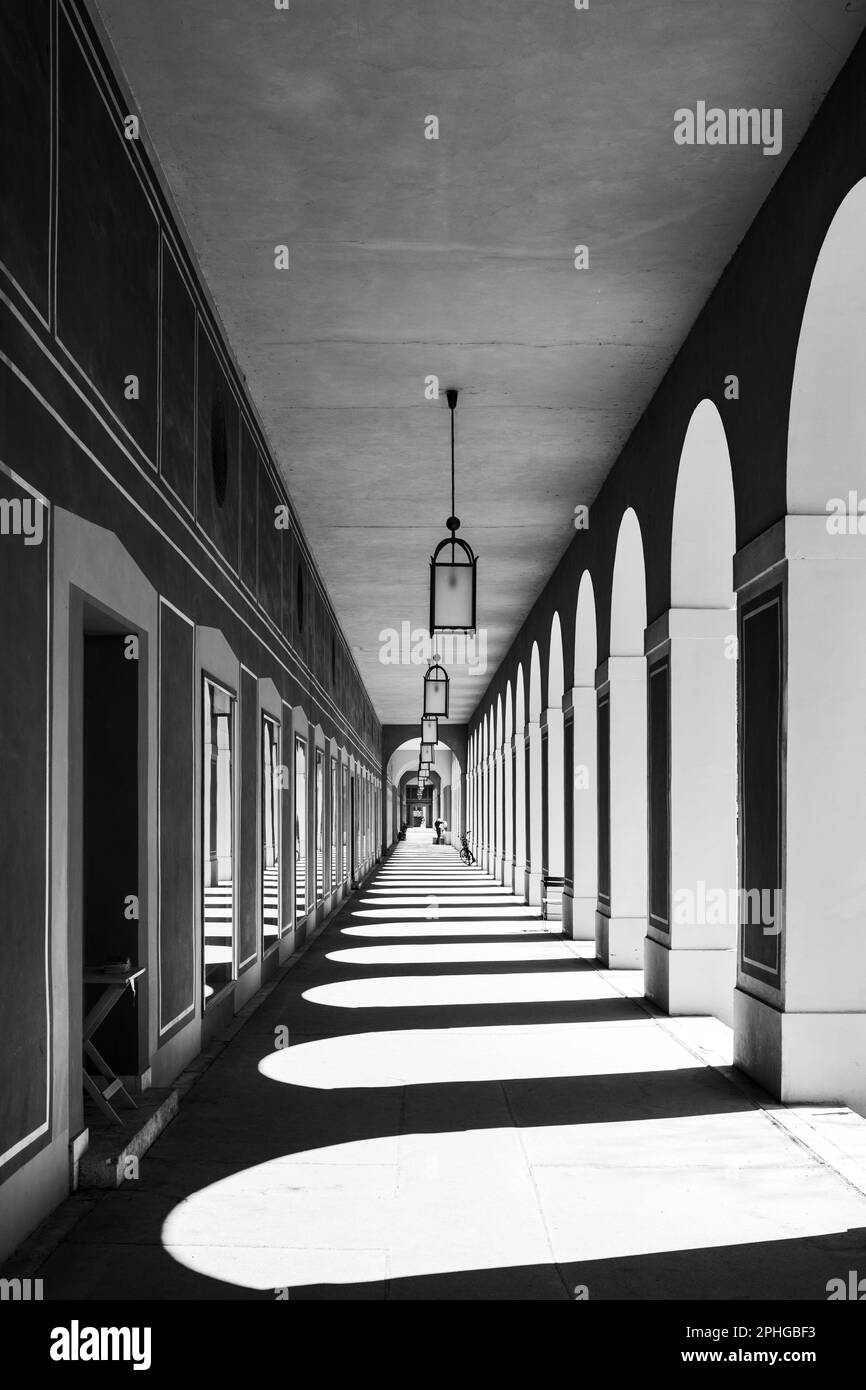 Arched walkway and shadows Stock Photo - Alamy