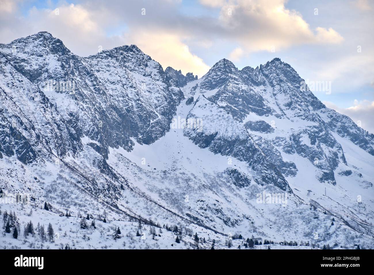 Tonale, Italy: view of passo del Tonale during winter with blue sky ...