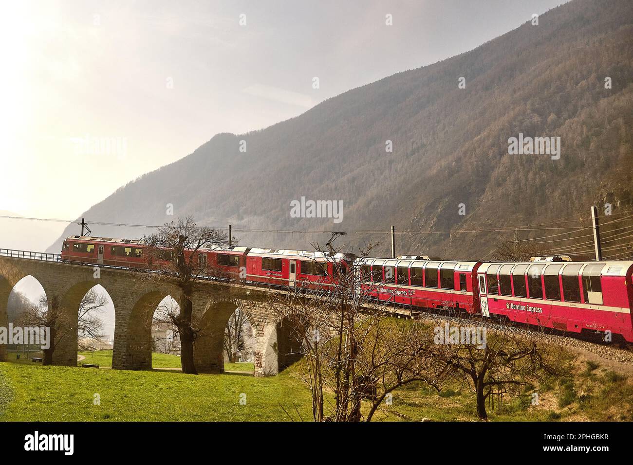 The famous Swiss mountain train of Bernina Express crossed italian and ...