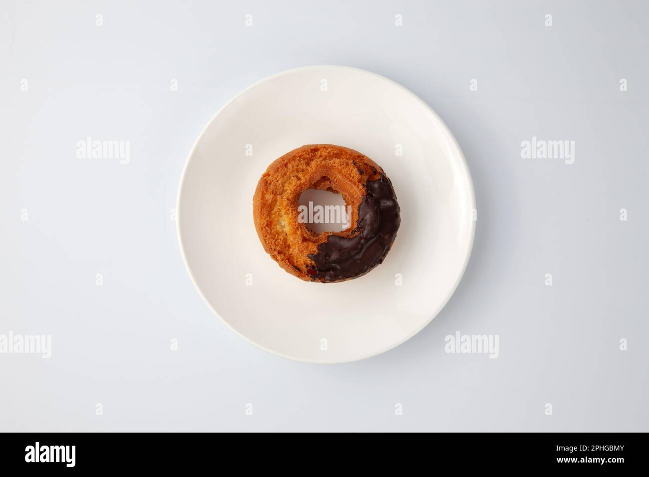old fashioned doughnut chocolate on plate isolated on white background ...