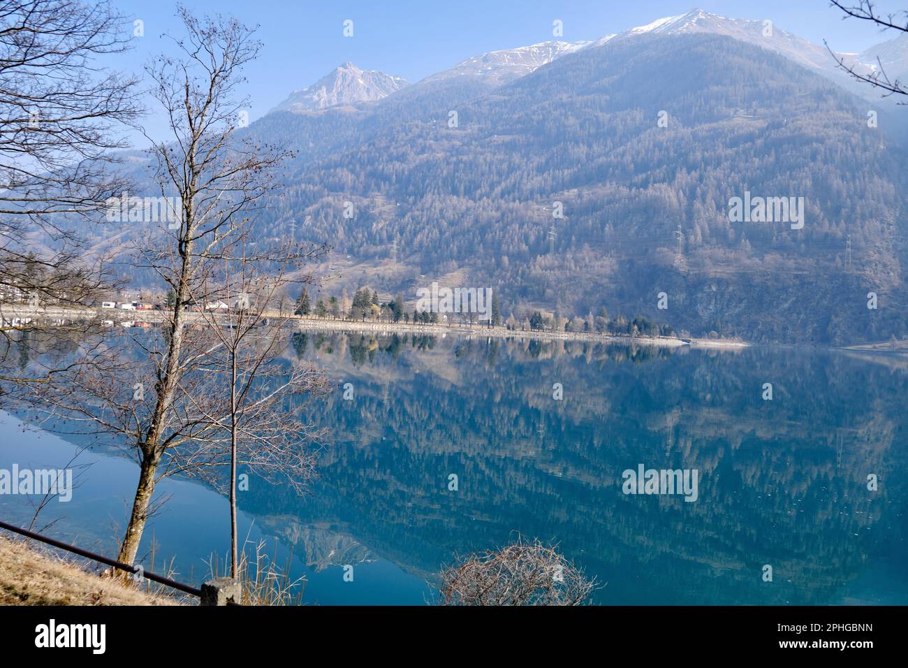 Panoramic view of the forest lake. Clear blue sky with dramatic glowing ...