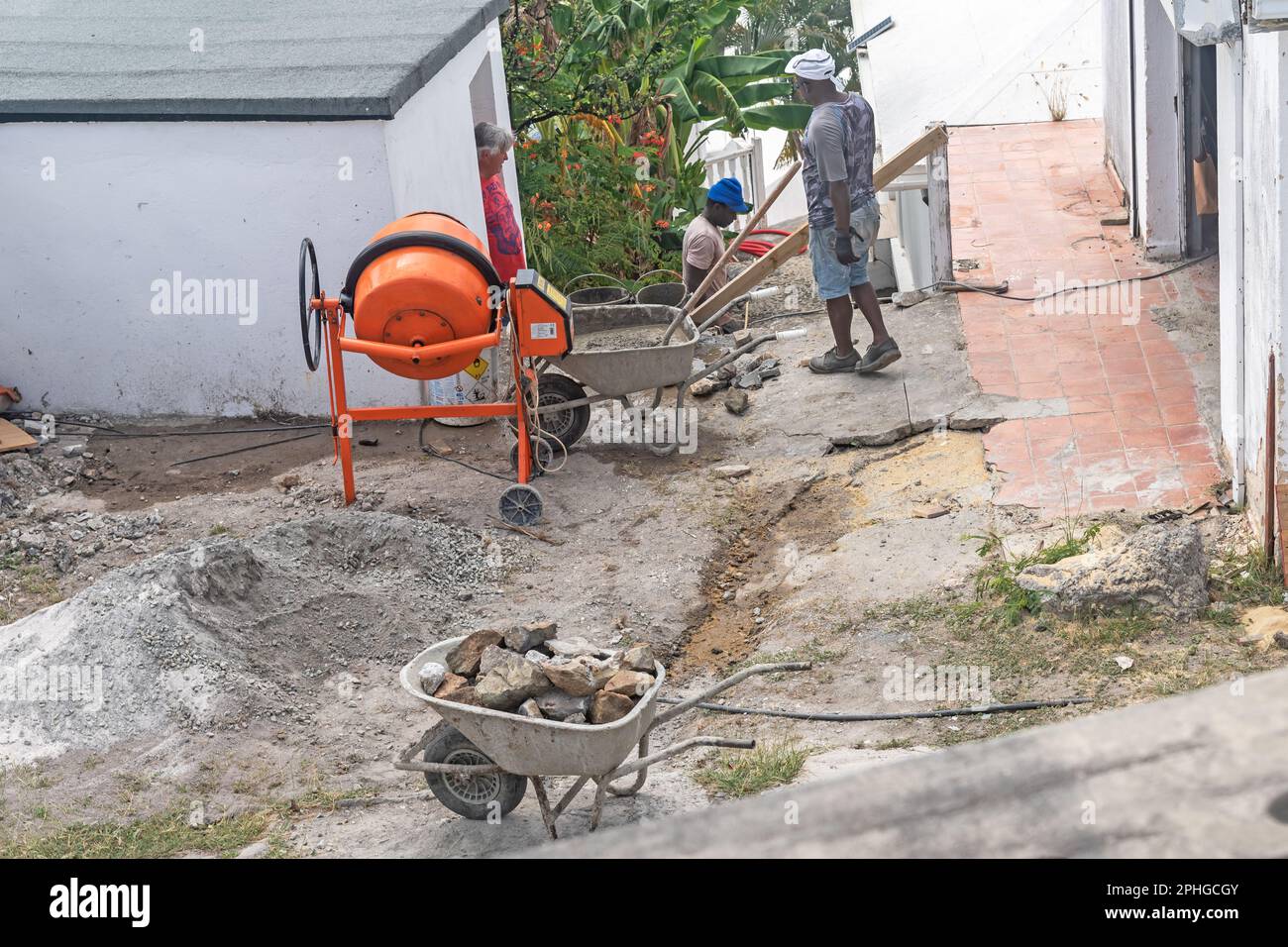 Workers perform repair work in a private house, St. Maarten, Eastern ...