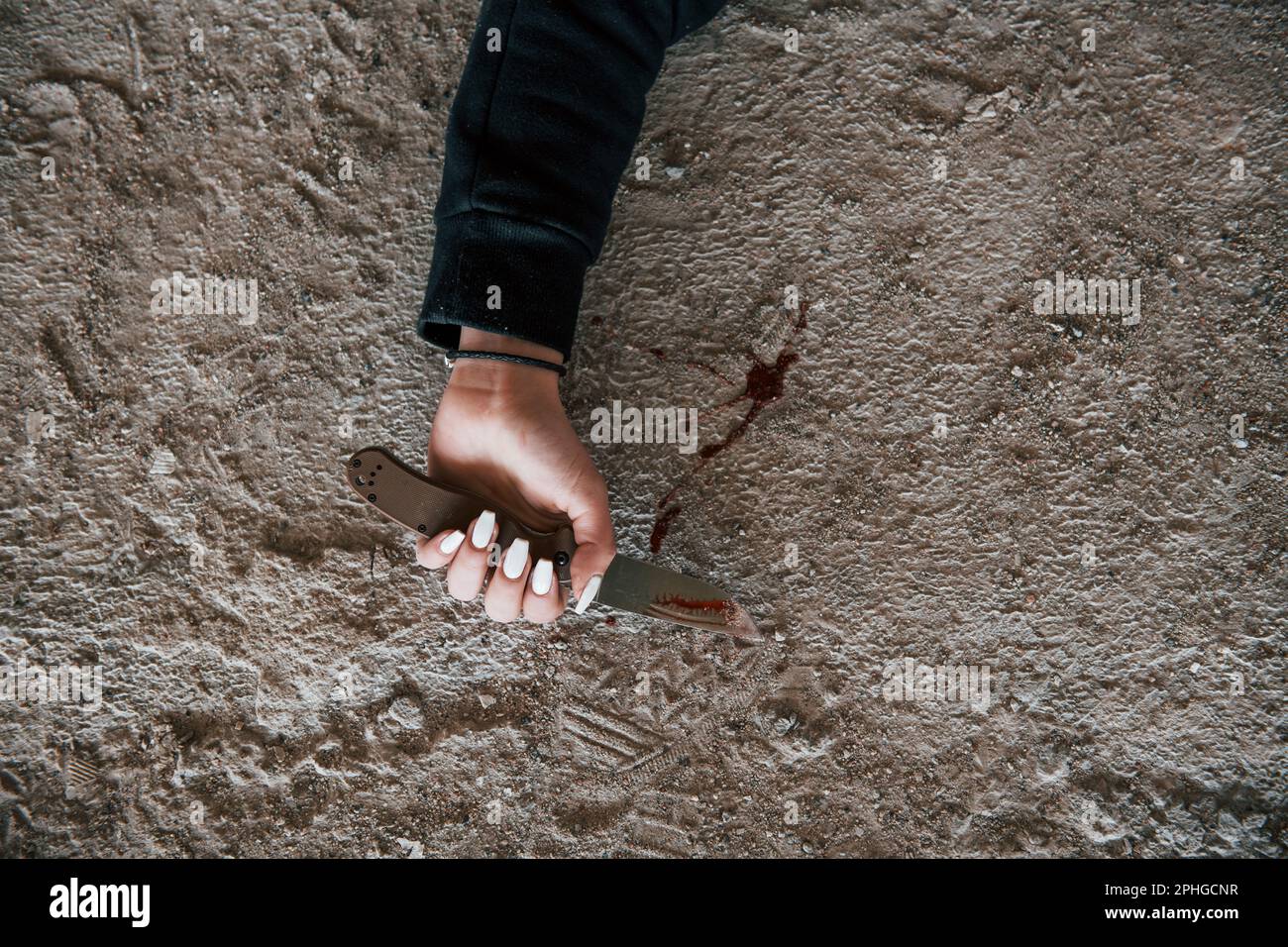 Close up view of hand of murdered female victim that lying down on the ...