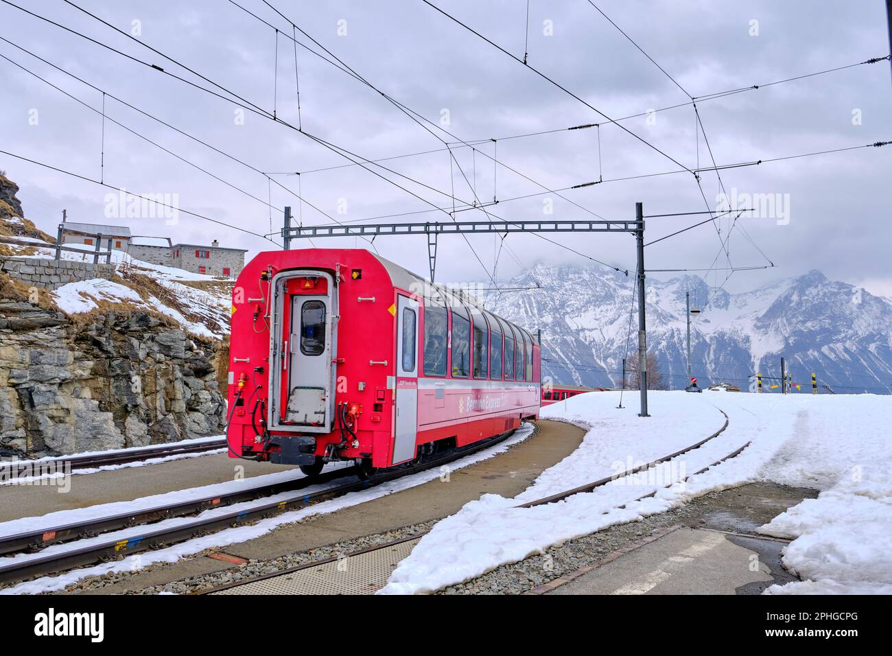 The famous Swiss mountain train of Bernina Express crossed italian and ...