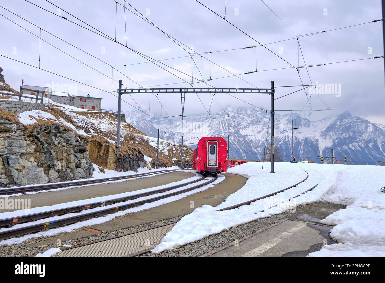 The famous Swiss mountain train of Bernina Express crossed italian and ...