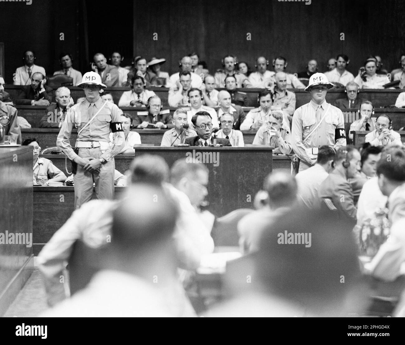 Henry Puyi, center, former puppet ruler of the Japanese in Manchuria ...
