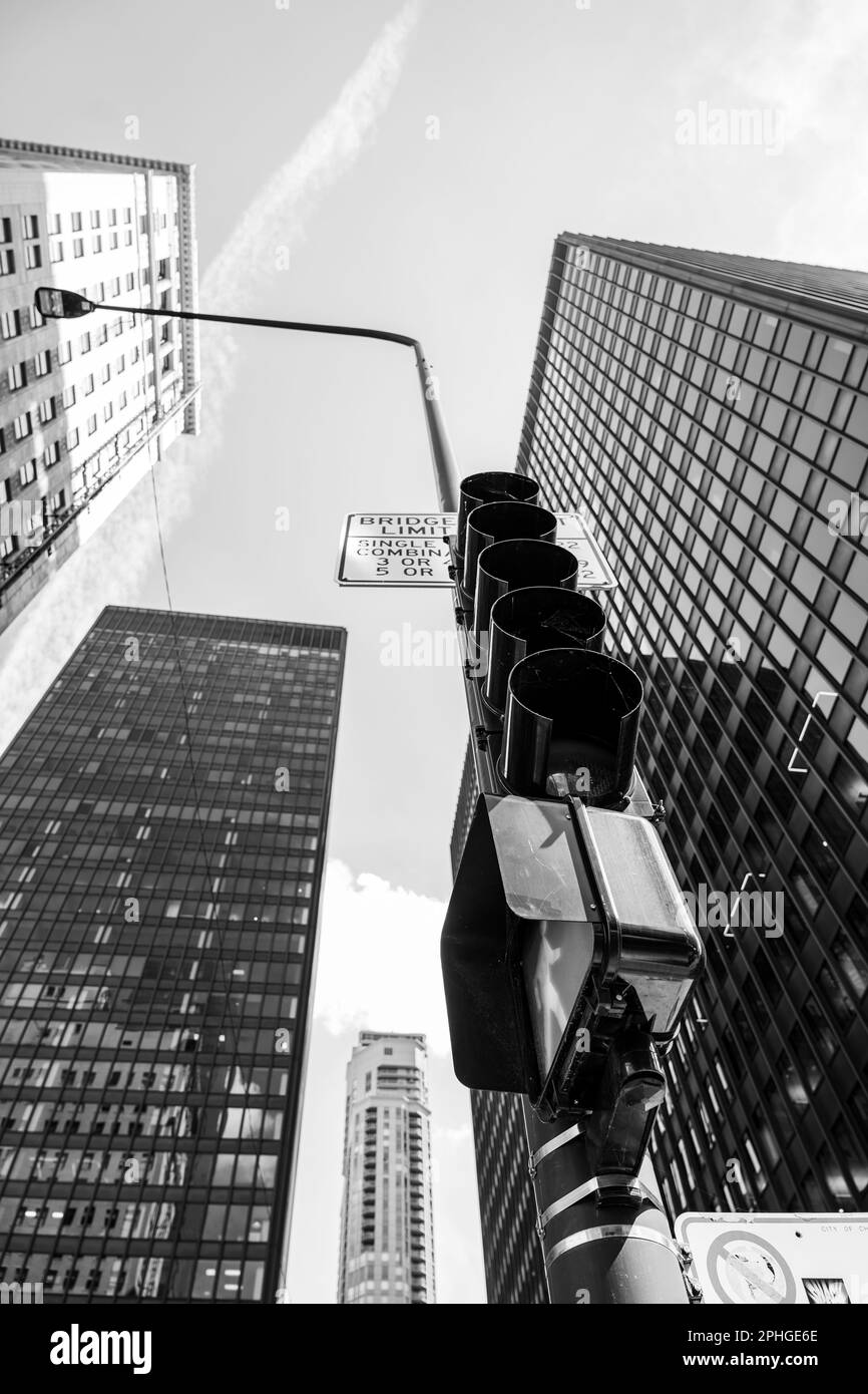 A bustling street intersection in a large city with high-rise buildings ...