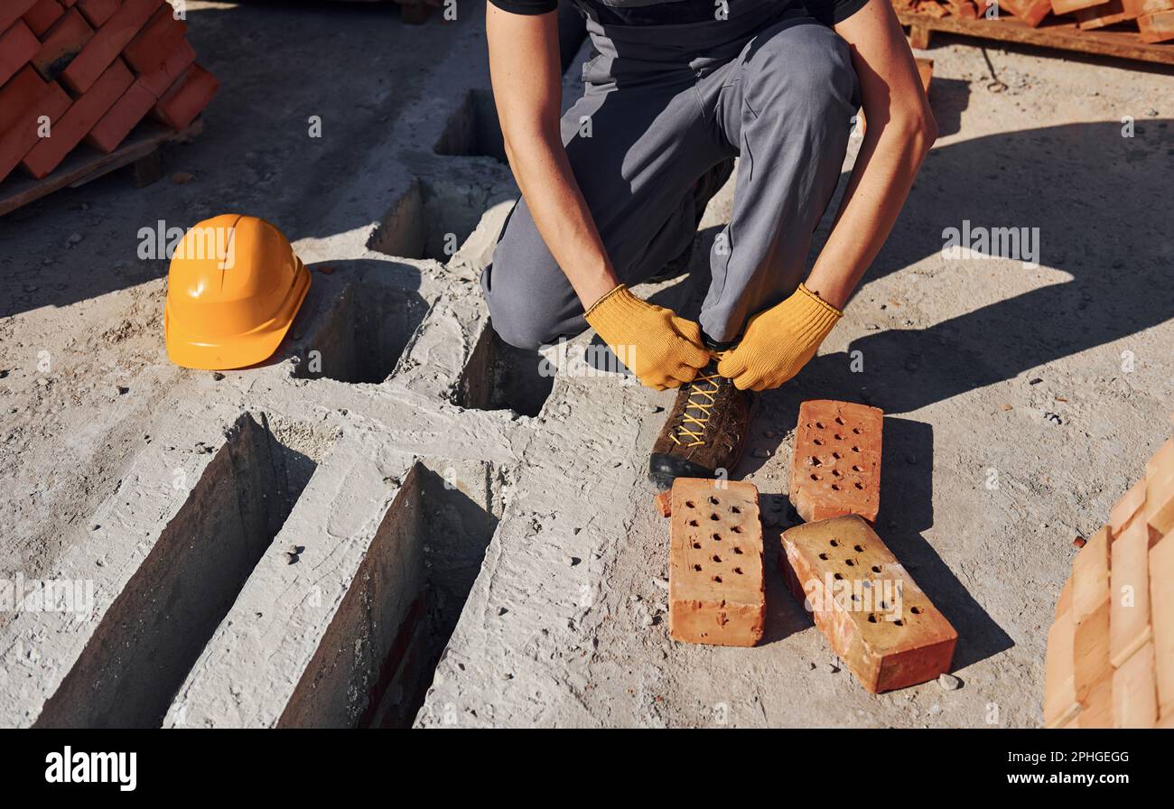 Close up view of construction worker in uniform and safety equipment ...