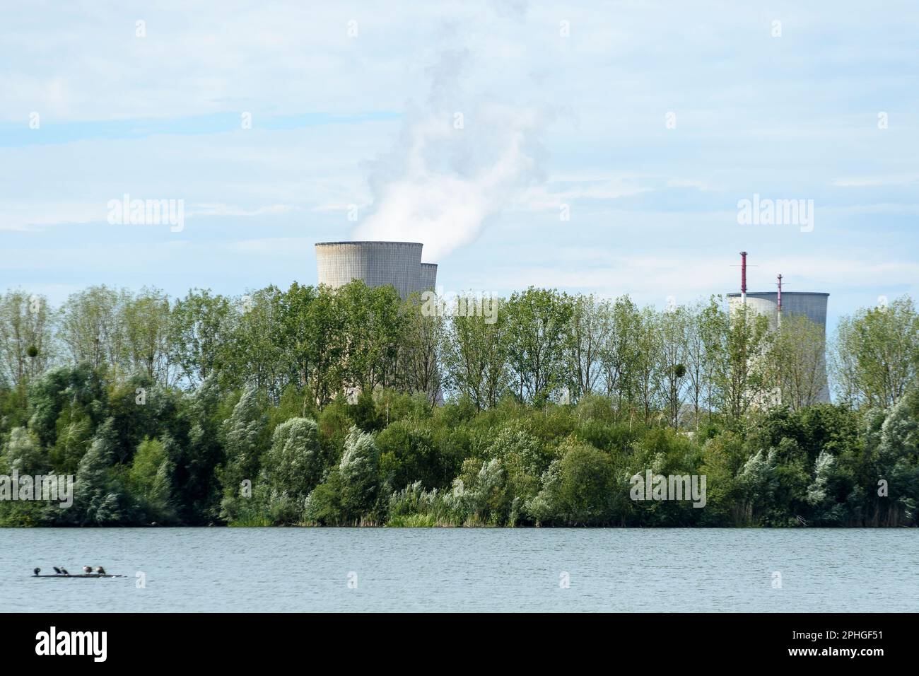 Chimney of the nuclear power plan of Tihange is located along the river ...