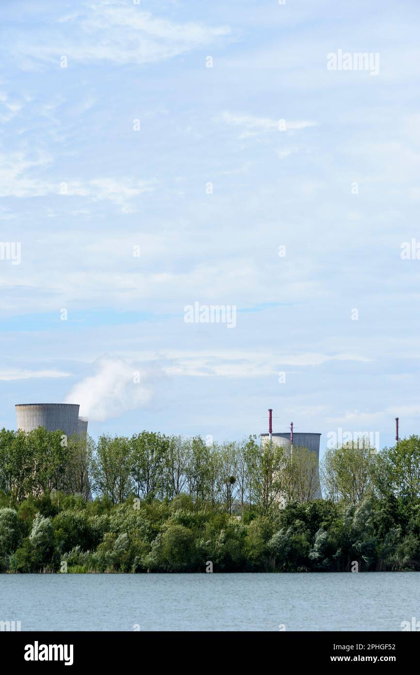 Chimney of the nuclear power plan of Tihange is located along the river ...