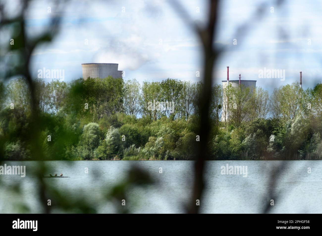 Chimney of the nuclear power plan of Tihange is located along the river ...