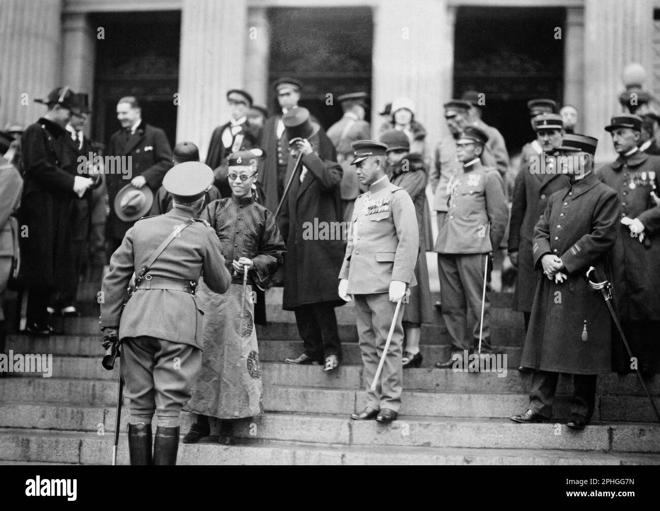 Former Emperor of China, Henry Puyi, center with glasses, greets a ...