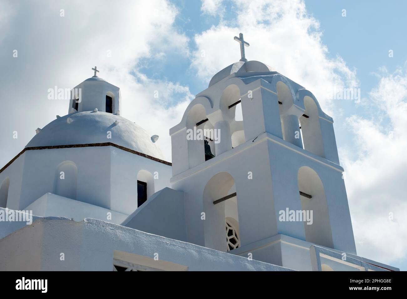A white Greek church shown against the sky on the island of Santorini ...