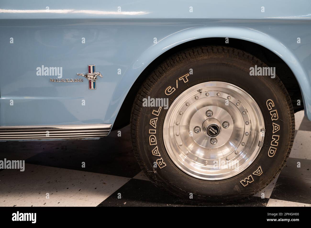 Detail of the wheel of a classic blue Ford Mustang from 1965 first ...