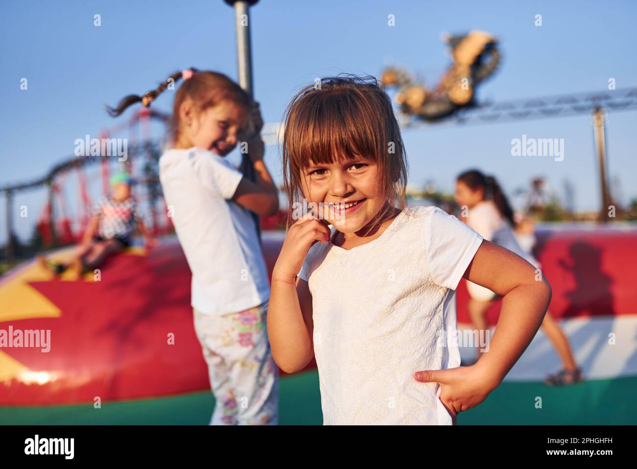 Little girls have fun at children's amusement park at daytime Stock ...