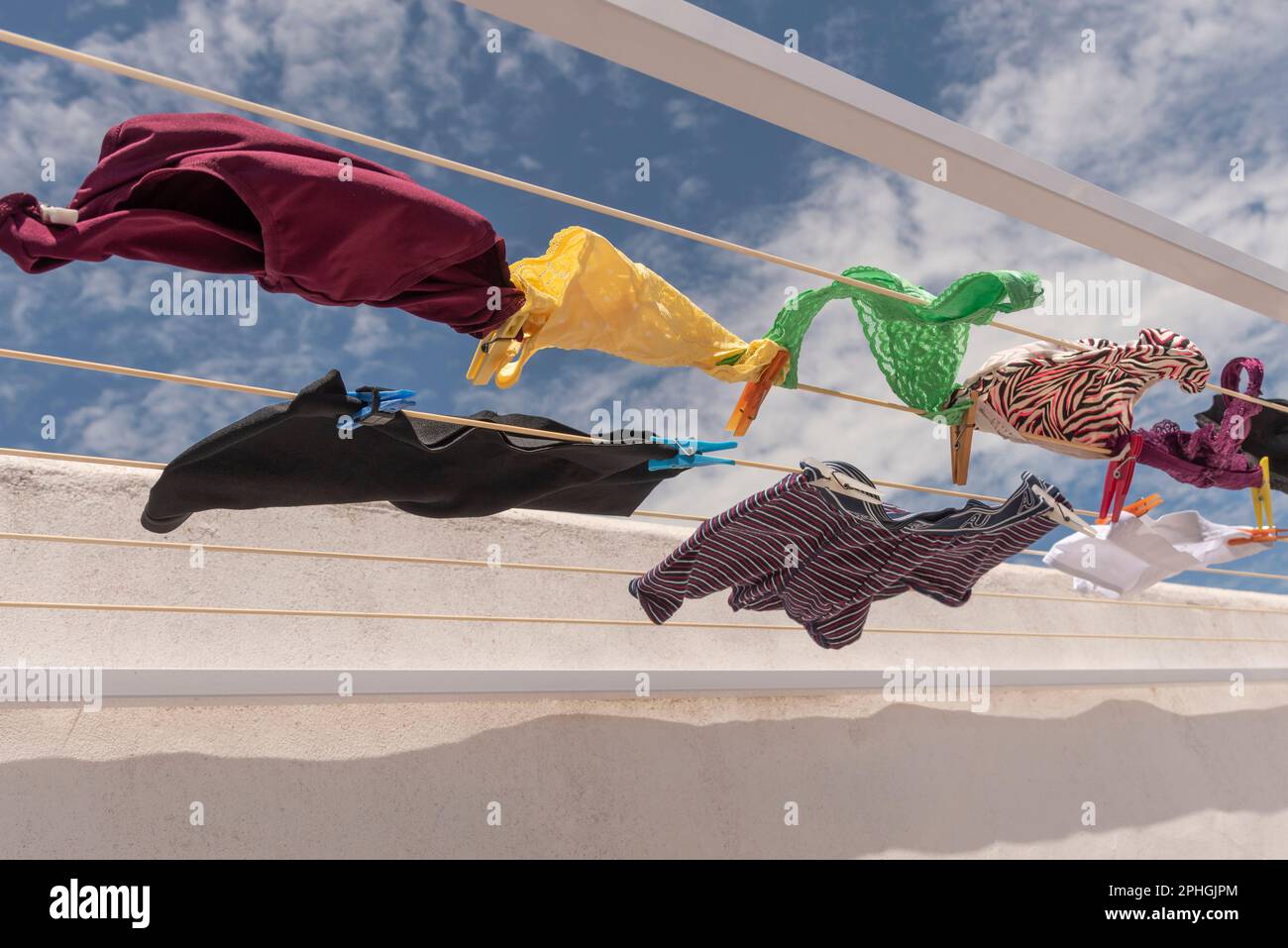 Langebaan, South Africa. 2023. Washing drying on a clothes line in a ...