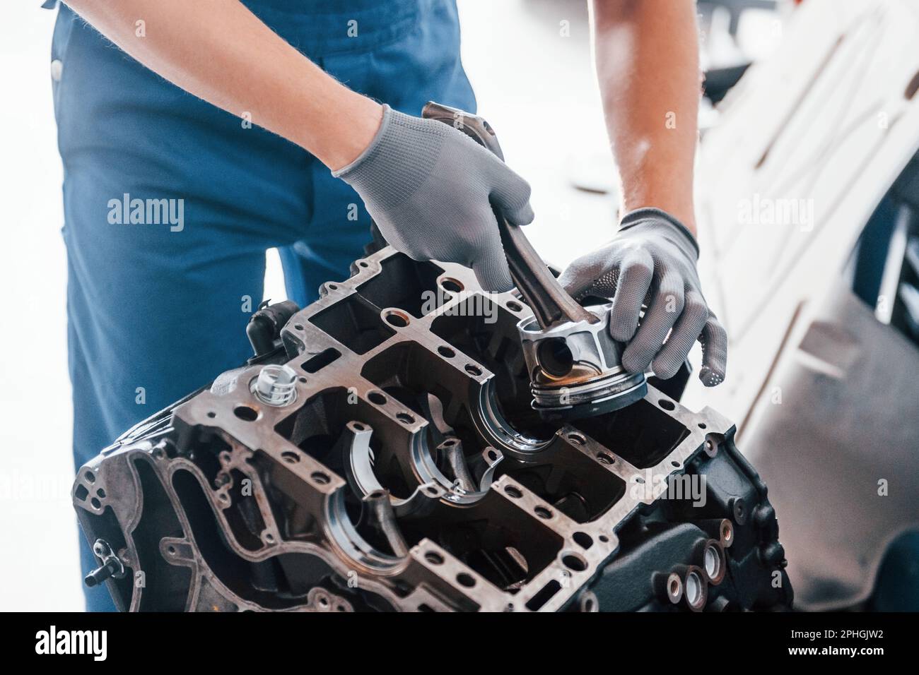 Professional repairman works with broken automobile engine Stock Photo ...