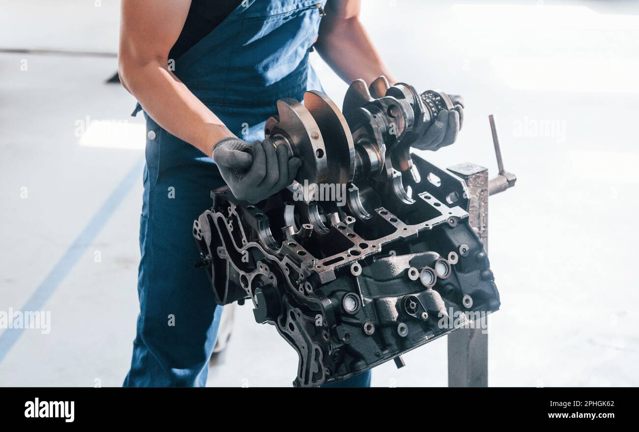 Professional repairman works with broken automobile engine Stock Photo ...